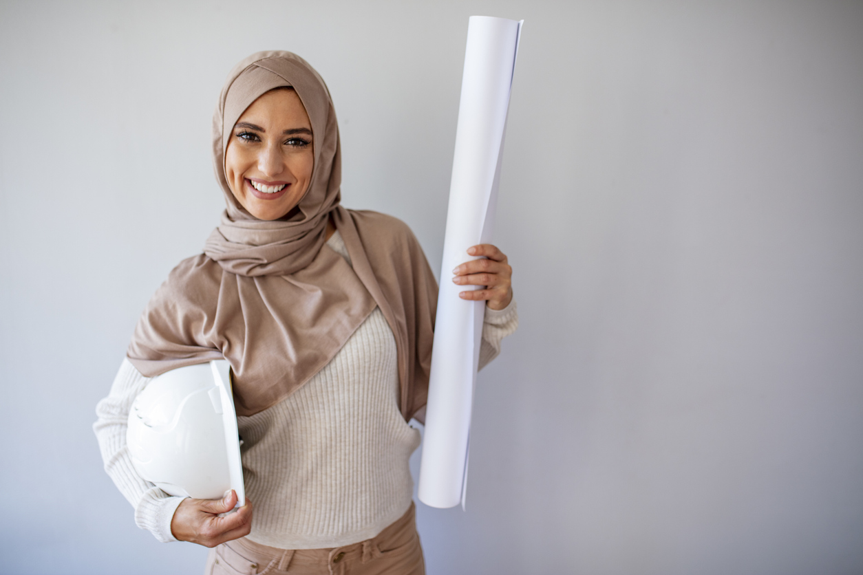 Muslim woman architect isolated in gray background – ASKMigration ...